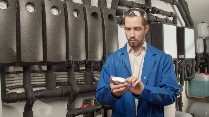 Young Engineer Checking New Equipment with Controller Stock Photo ...