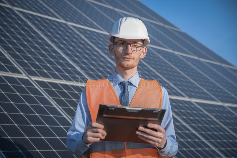An Young Engineer is Checking with Tablet an Operation of Sun and ...