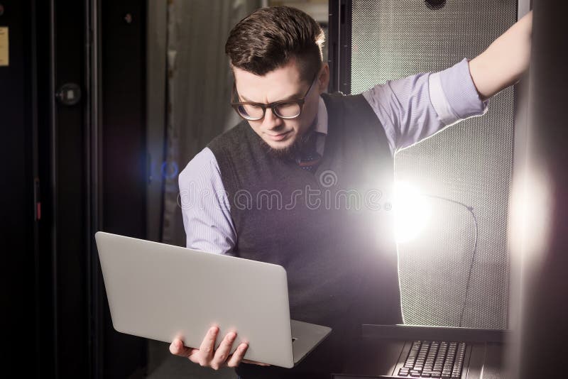 The engineer in datacenter stock image. Image of laptop - 21350375