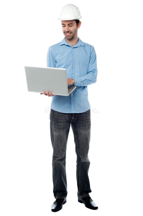 Young engineer with laptop stock image. Image of helmet - 45586915