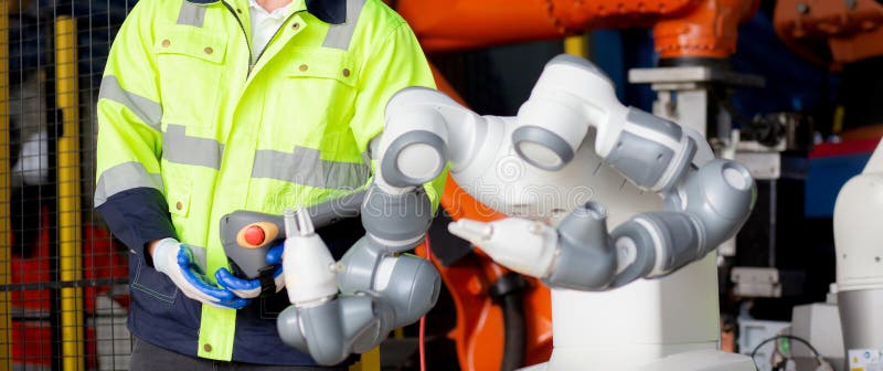 Young Engineer Man Checking and Maintenance Machine Robot Arms ...