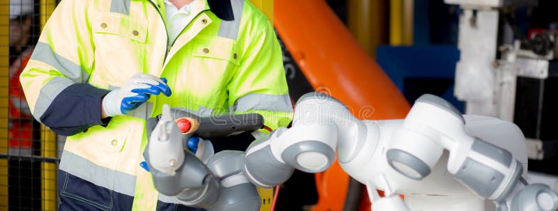 Young Engineer Man Checking and Maintenance Machine Robot Arms ...