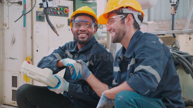 Young Engineer Man Talking and Explaining about Robot Arms Technology ...