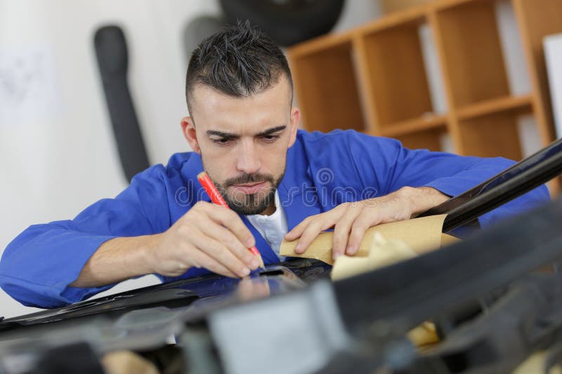 Young Engineer Marking Position with Pencil Stock Photo - Image of ...