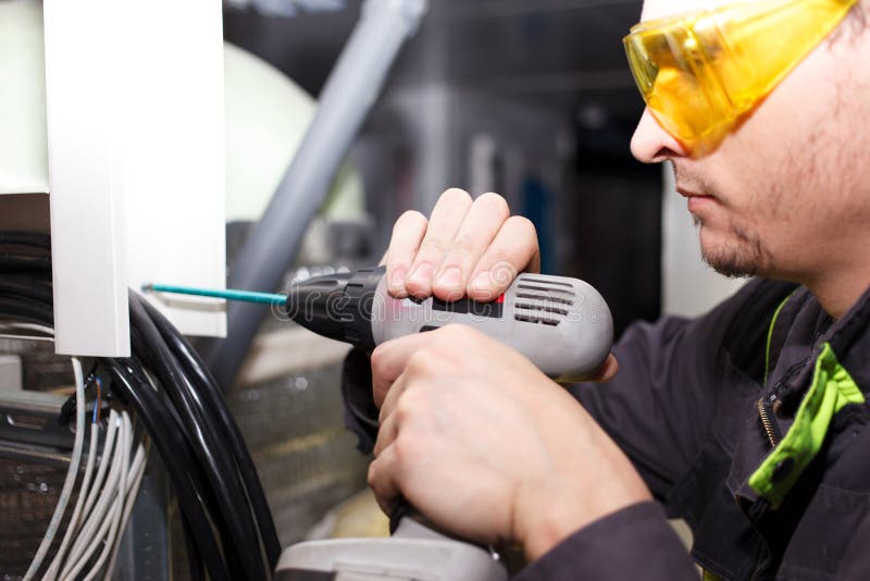 Young Engineer at the Plant Stock Photo - Image of screwdriver, bared ...