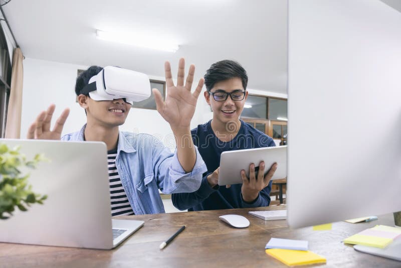 Young Programmer with Virtual Reality Glasses To Testing 3D Application ...