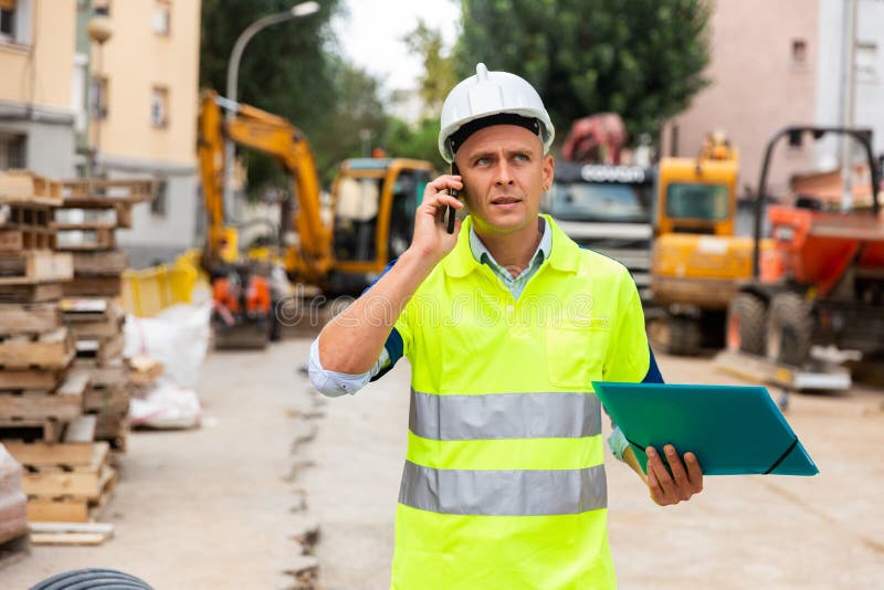 Young Engineer is Talking on a Mobile Phone Stock Image - Image of ...