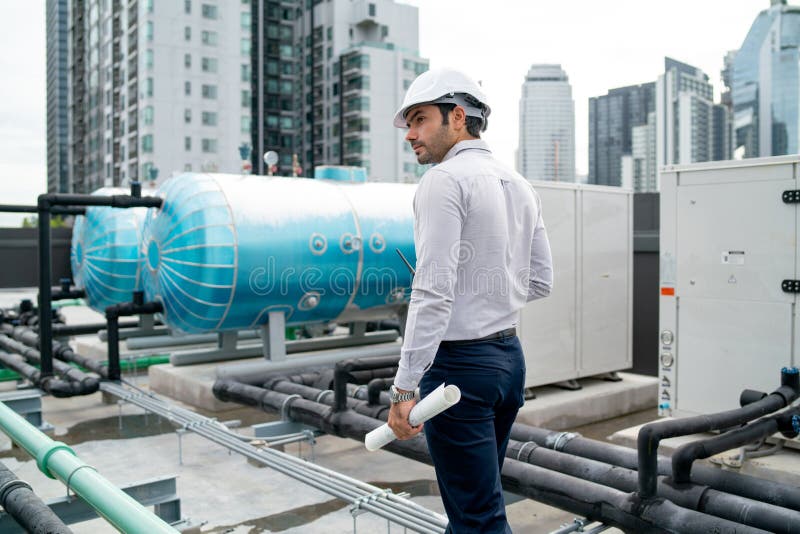 Young Engineer or Technician Man Hold Building Plan or Drawing and Walk ...