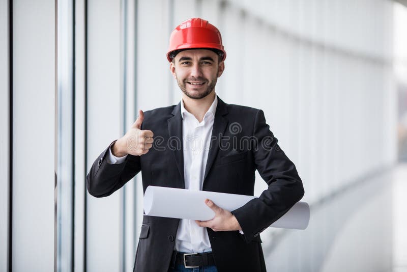 Young Engineer with Thumbs Up Indoors Near Panoramic Windows Stock ...