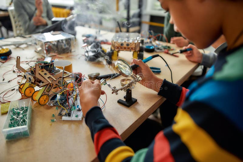 There is No Impossible. Cropped Shot of Young Engineer Using Soldering ...