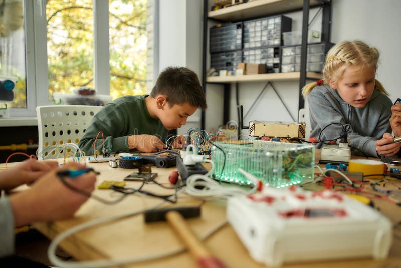You Dream it, I Make it. Young Engineer Using Soldering Iron To Join ...