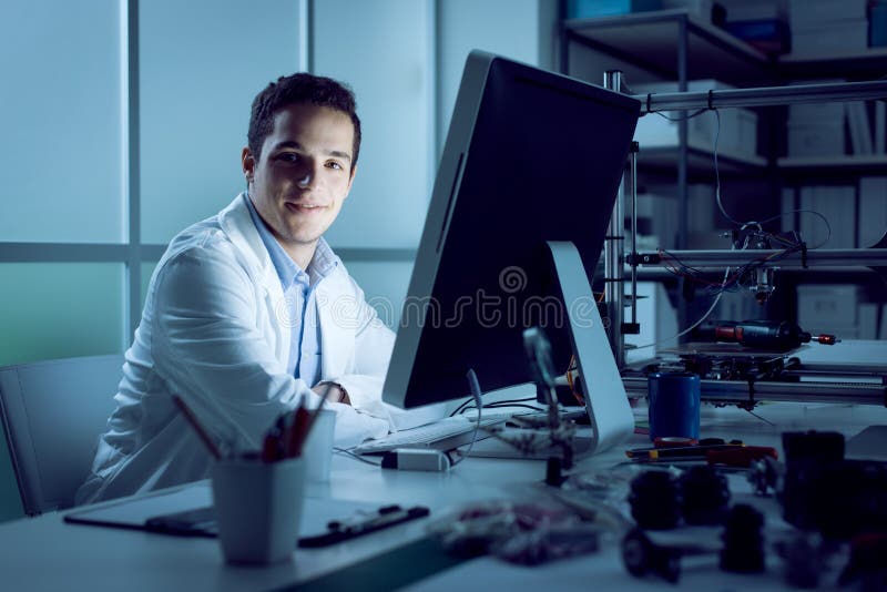 Young Engineer Working at Desk Stock Photo - Image of desk, office ...