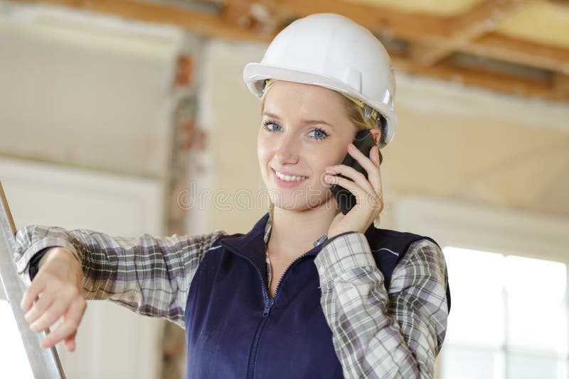 Young Engineer Woman with Safety Helmet Talking on Phone Stock Image ...