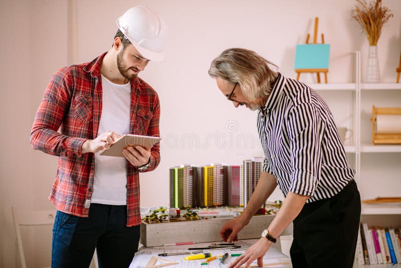 Young Engineer Work with Senior Architect in the Office Stock Photo ...