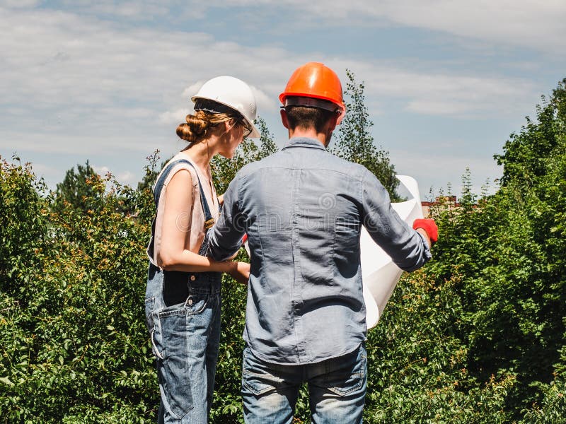 Young Engineer and Worker in the Park Stock Image - Image of holding ...