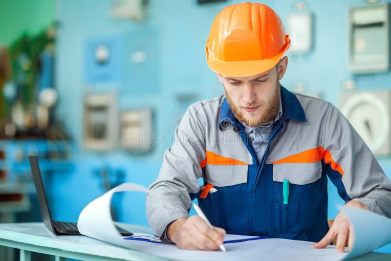 Young Engineer Working with Blueprint at Control Room Stock Image ...
