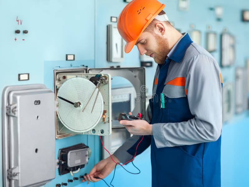 Young Engineer Working at Control Room Stock Photo - Image of gear ...