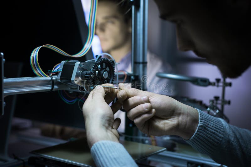 Young Engineer Working on a 3D Printer Stock Photo - Image of design ...