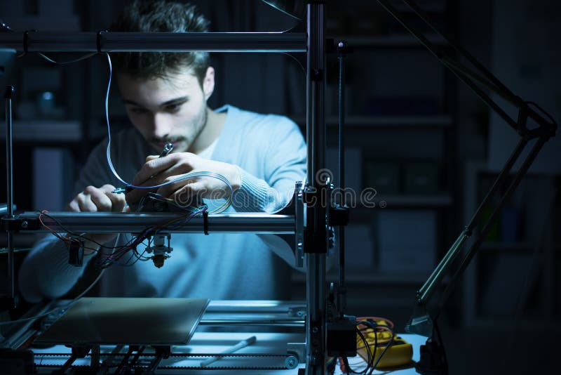 Young Engineer Working on a 3D Printer Stock Image - Image of ...