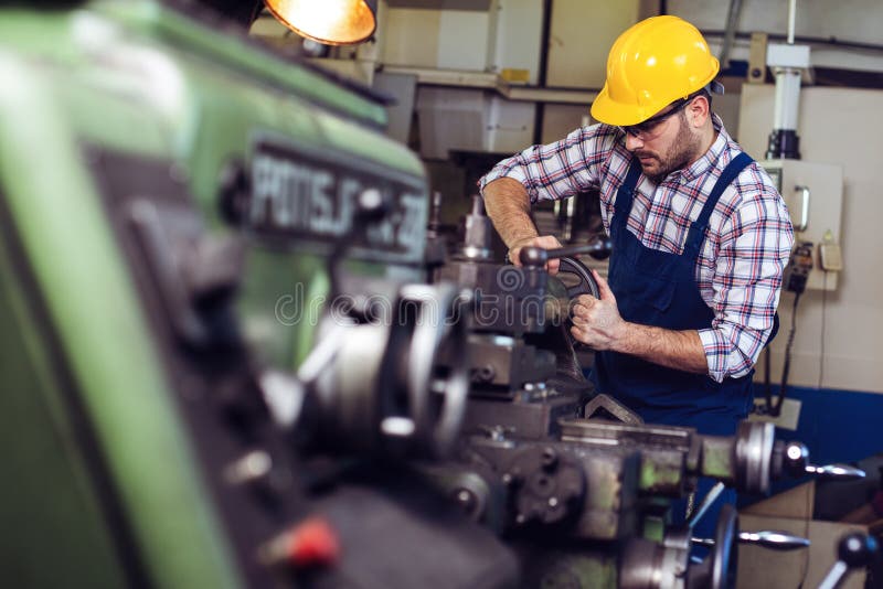 Man Operating Lathe Grinding Machine Stock Photo - Image of factory ...