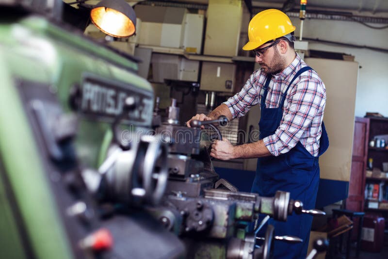 Man Operating Lathe Grinding Machine Stock Photo - Image of factory ...