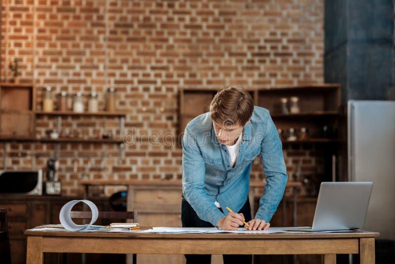 Young Engineer Working on a New Blueprint Stock Image - Image of civil ...