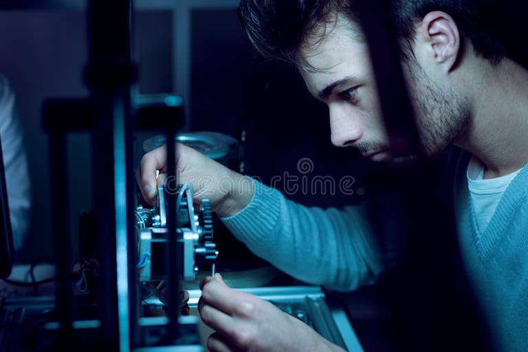 Young Engineer Working on a 3D Printer Stock Image - Image of printing ...