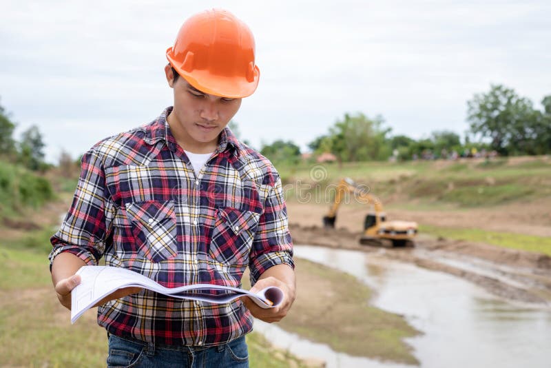 Young Engineer Working on Site at the Dam Stock Photo - Image of ...