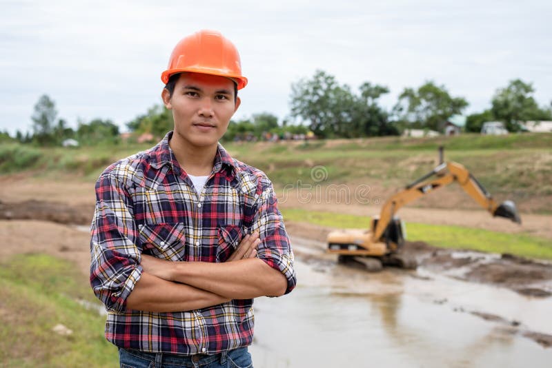 Young Engineer Working on Site at the Dam Stock Photo - Image of digger ...