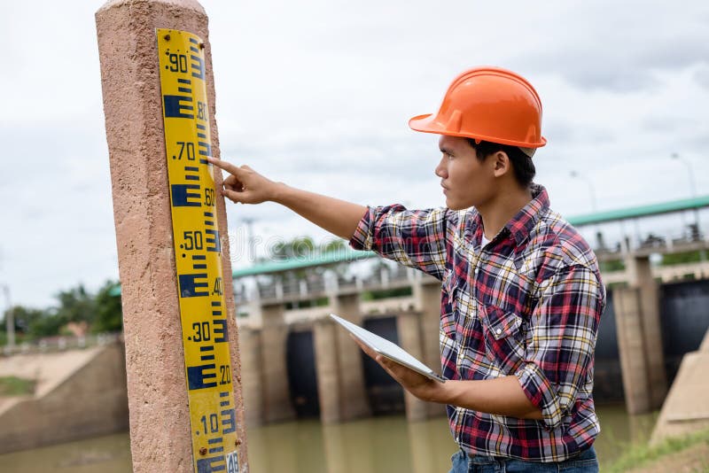 Young Engineer Working on Site at the Dam Stock Image - Image of ...