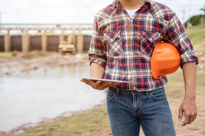 Young Engineer Working on Site at the Dam Stock Image - Image of ...