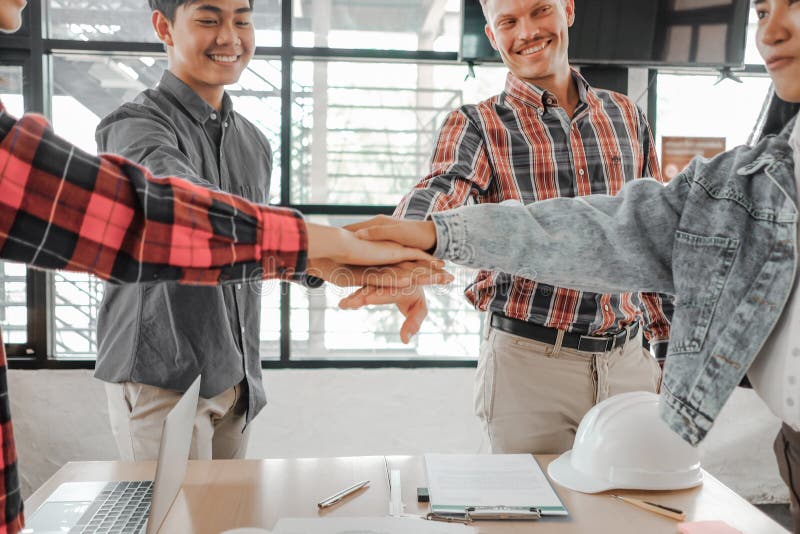 Young Engineers Partners Teamwork Group Putting Their Hands Together ...