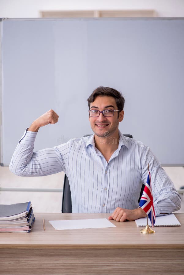 Young Male English Language Teacher in the Classroom Stock Photo ...