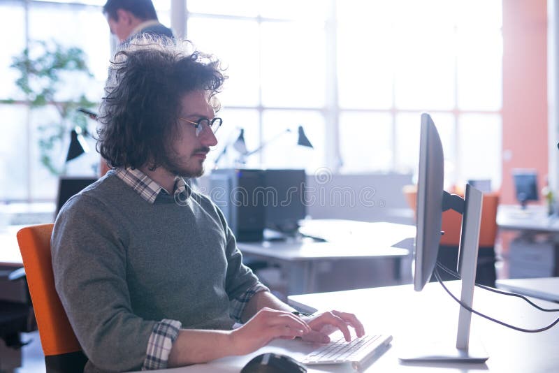 Businessman Working Using a Computer in Startup Office Stock Image ...