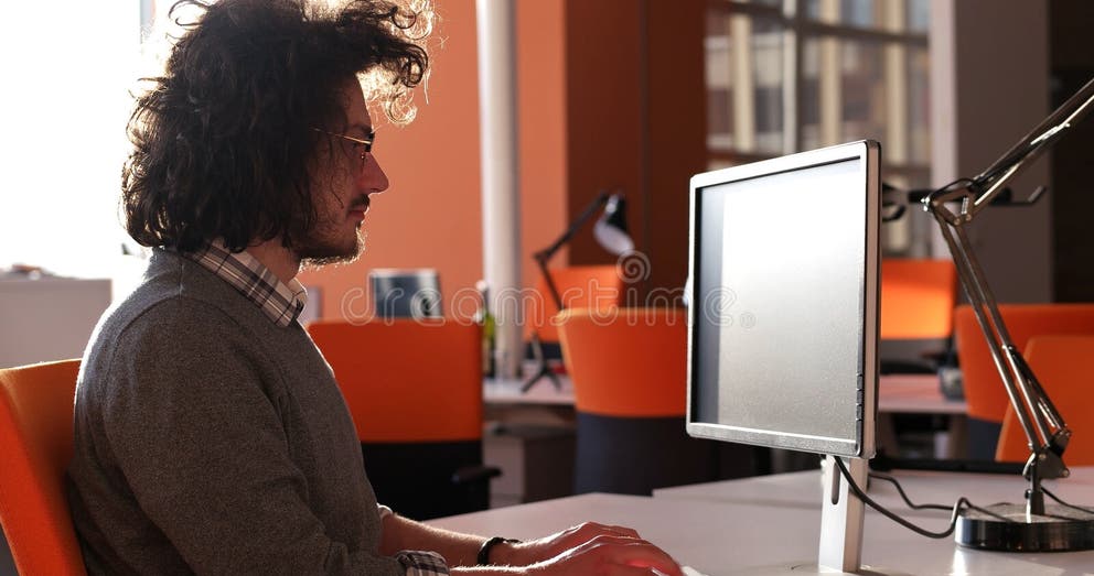 Businessman Working Using a Computer in Startup Office Stock Image ...