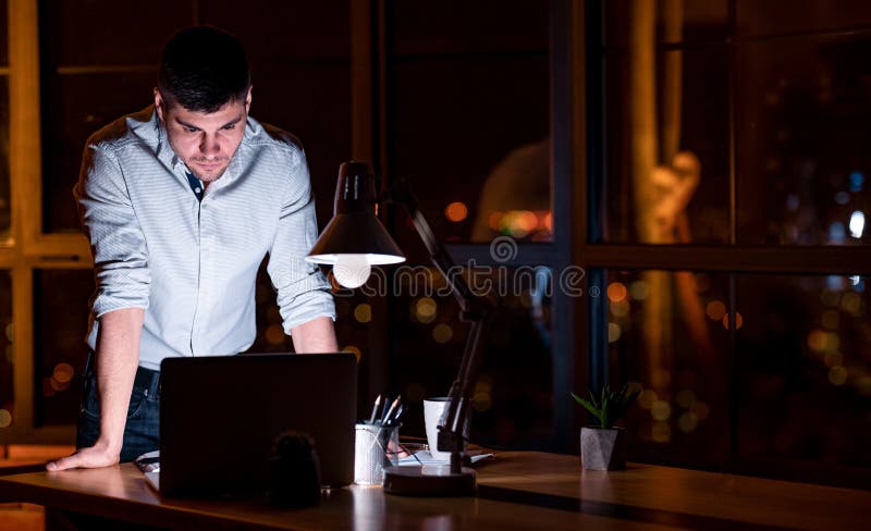 Entrepreneur Guy Standing Working on Laptop in Office at Night Stock ...