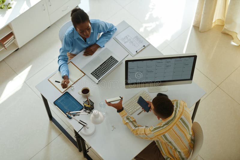 Young Entrepreneurs Discussing Project Ideas Stock Image - Image of ...