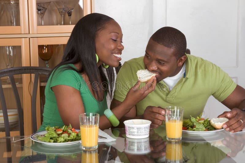 Young Ethnic Couple by Table Eating Breakfast Stock Photo - Image of ...