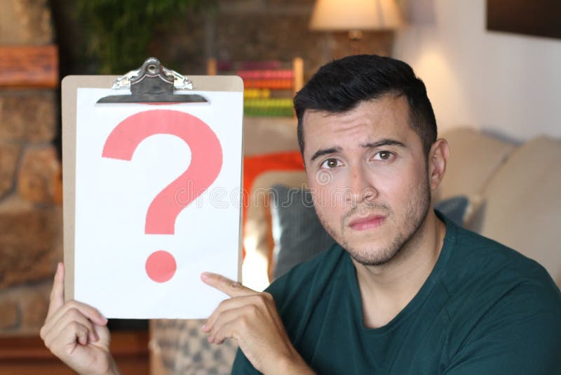 Young Ethnic Man Holding Question Mark Stock Photo - Image of question ...