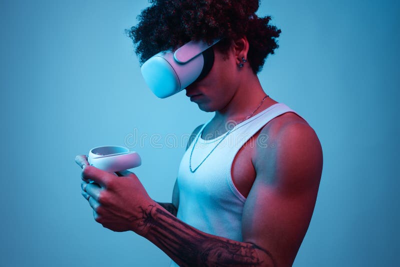 Young Ethnic Man Standing in VR Headset and Checking Controller in ...