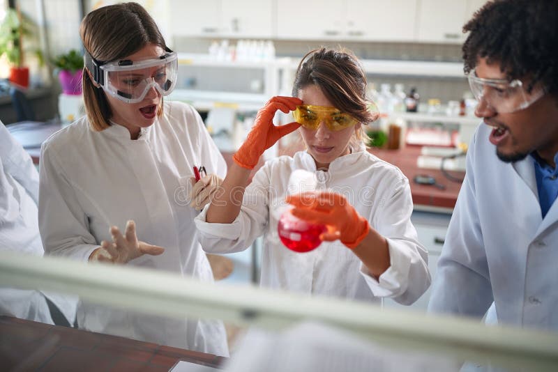 Young Excited Chemistry Students are Observing a Chemical Reaction in ...