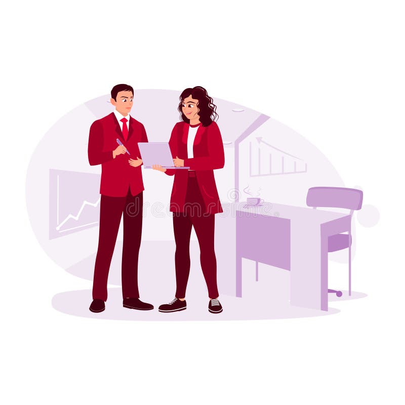 Young Executive Talking To an Employee Using Laptop in Office. Stock ...