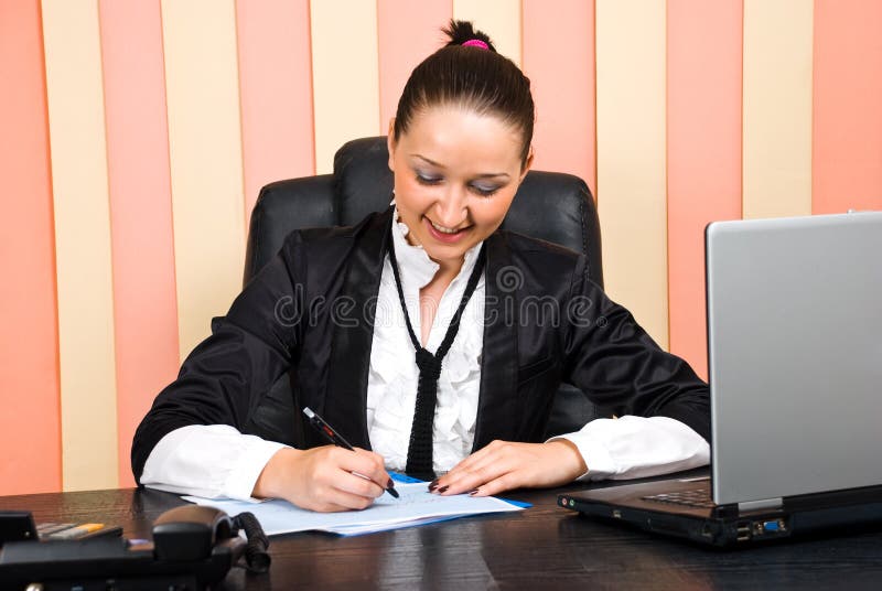 Young Executive Woman Writing on Papers Stock Photo - Image of ...