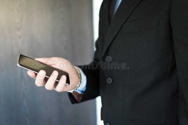 A Young Executive Working on His Mobile Phone Stock Photo - Image of ...