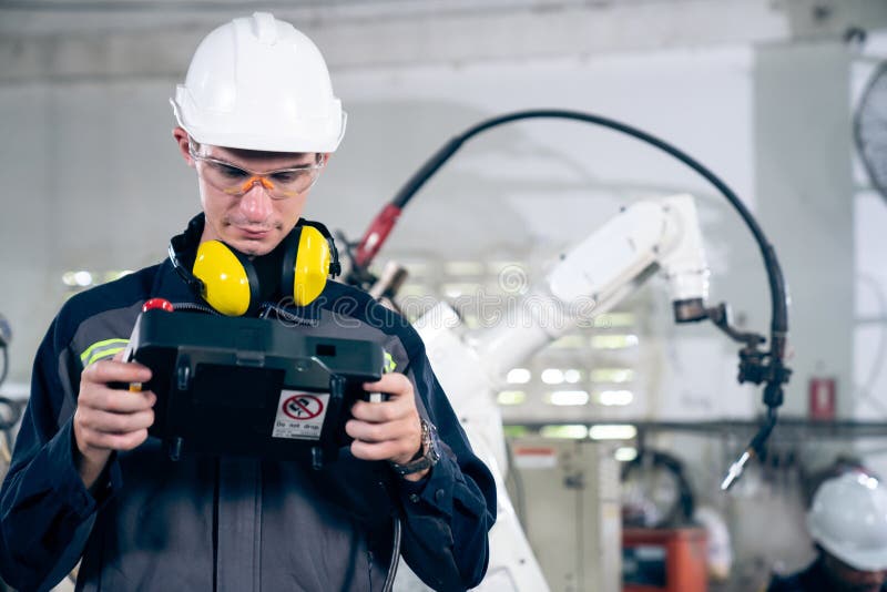 Young Factory Worker Working with Adept Robotic Arm Stock Image - Image ...