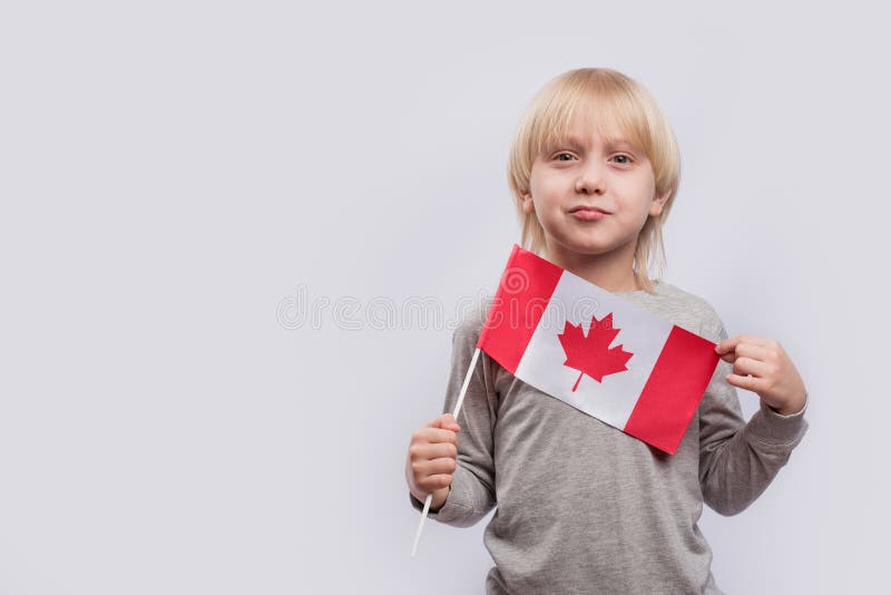 Young Fair-haired Boy Holding Flag of Canada. Education in Canada Stock ...