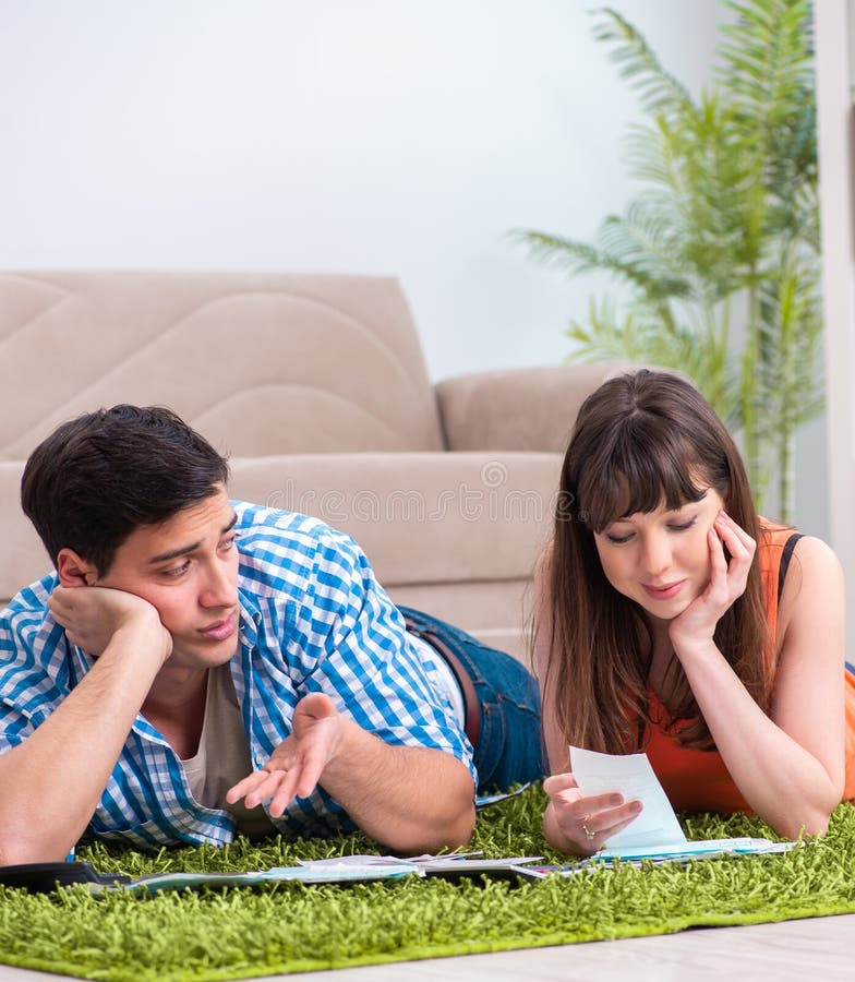Young Family in Budget Planning Concept Stock Photo - Image of money ...