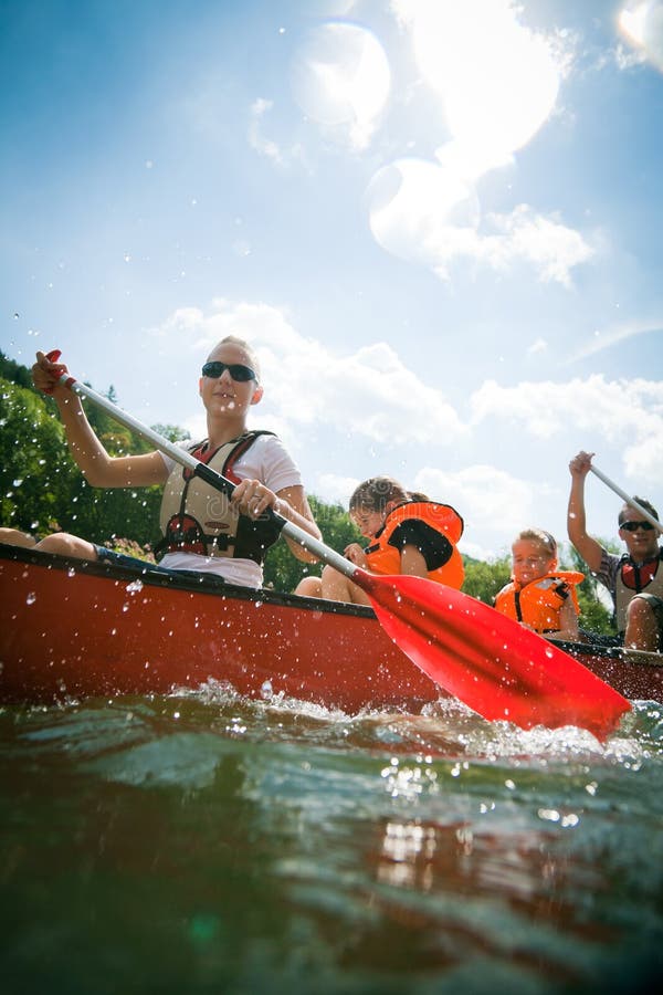 Young Family Canoeing stock image. Image of water, canoeing - 84237865