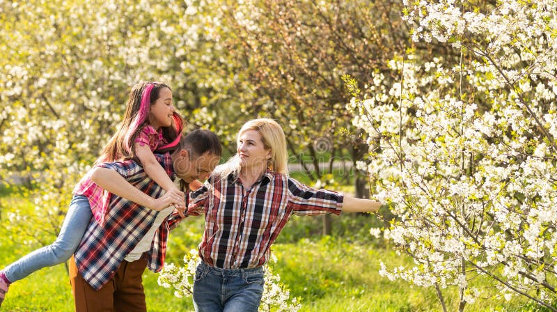 Young Family with Child Having Fun in Nature Stock Photo - Image of ...