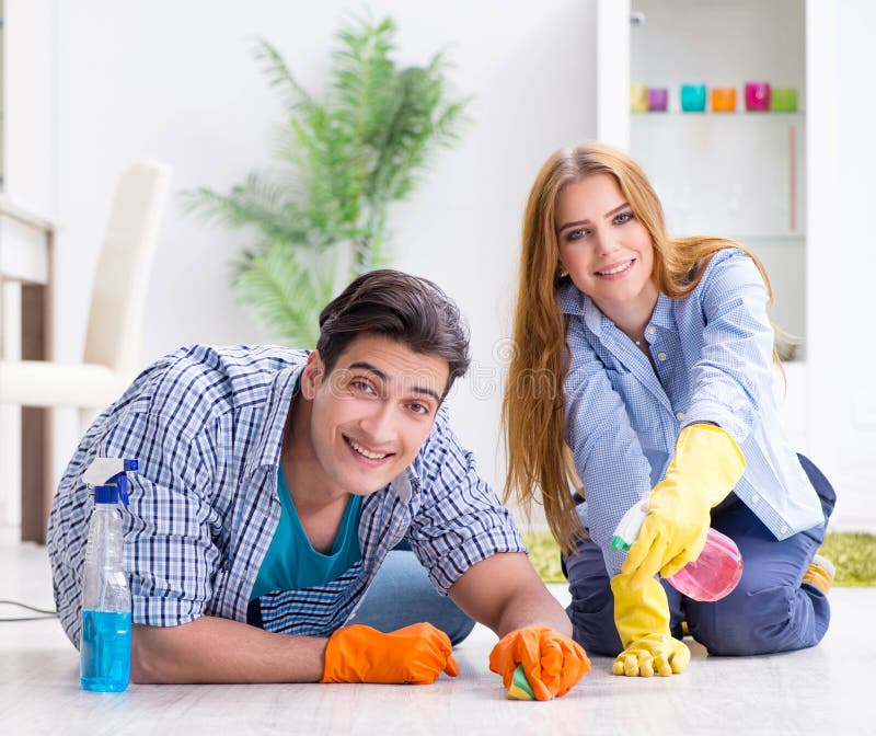 Young Family Cleaning the House Stock Photo - Image of couple ...